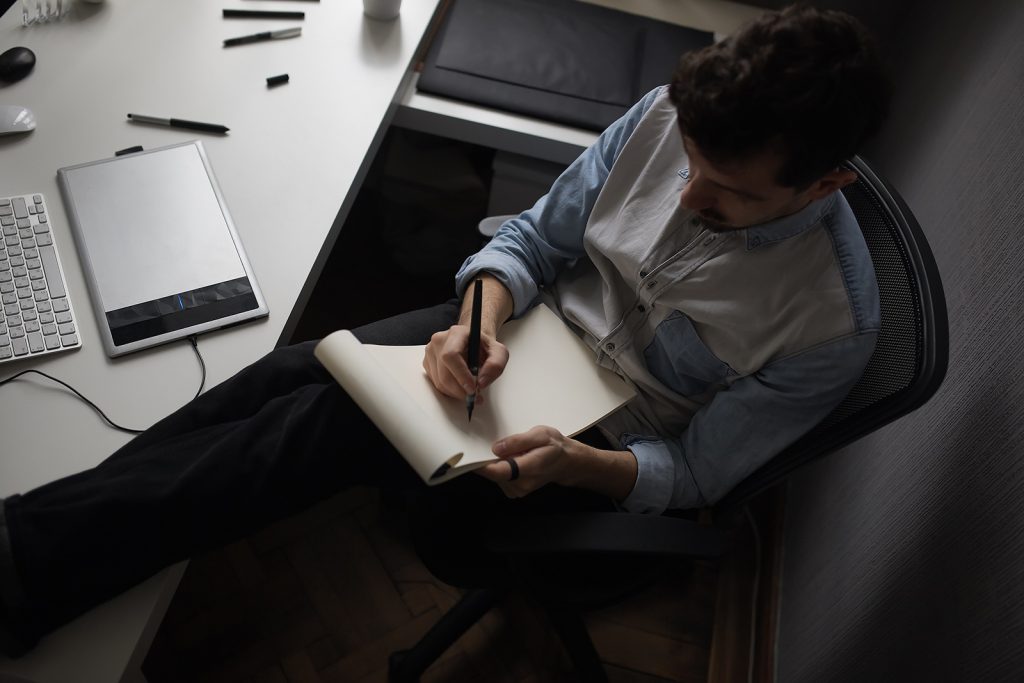 Designer drawing design project. | Hopping Frog Studios